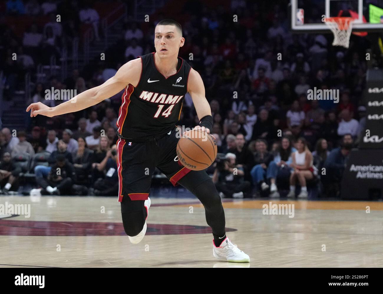 Miami Heat guard Tyler Herro (14) dribbles during the first half of an ...