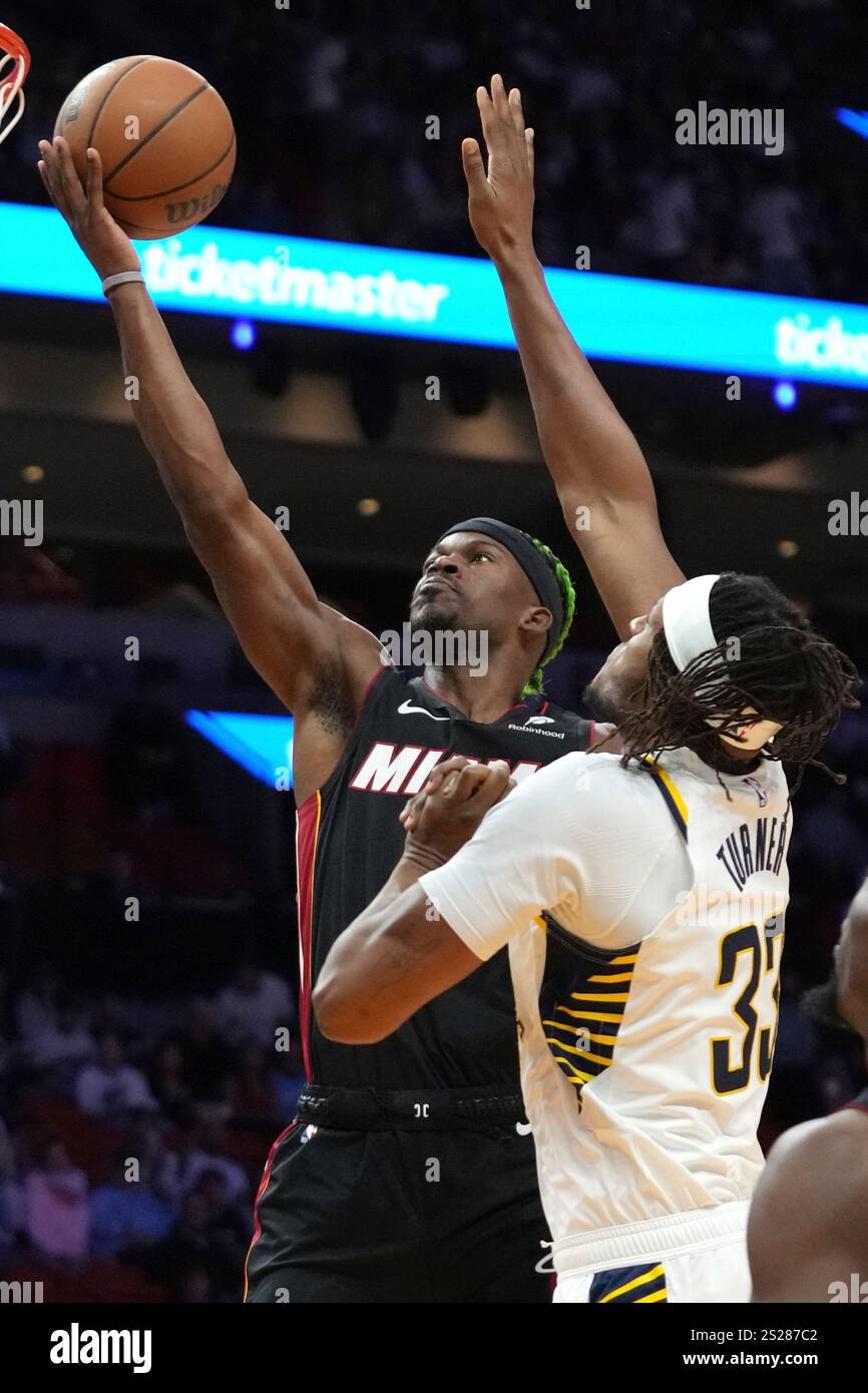 Miami Heat forward Jimmy Butler (22) shoots as Indiana Pacers center ...