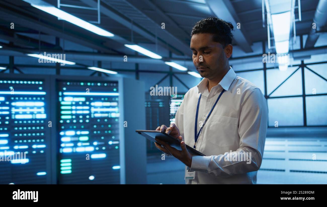 Engineer Walking In Data Center Monitoring Security Threats