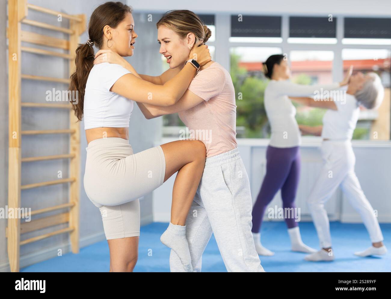 Two young women training self-defense techniques Stock Photo - Alamy