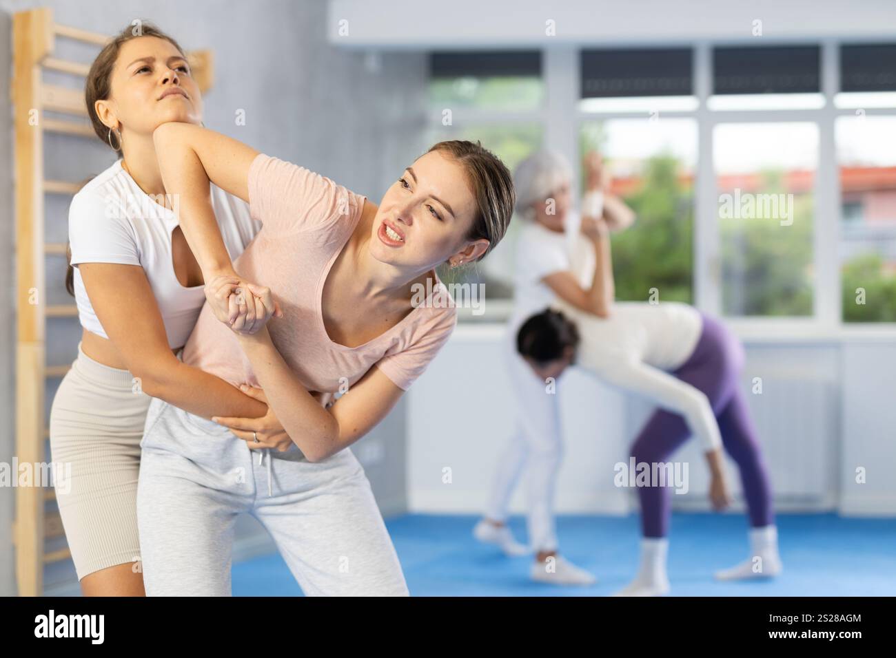 Two young women training self-defense techniques Stock Photo - Alamy