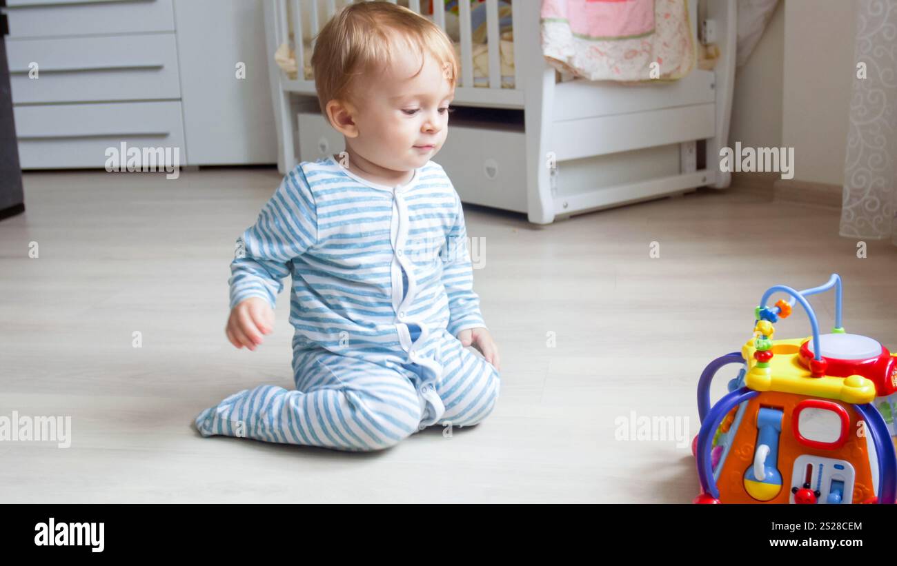 1 year old toddler boy playing on floor at living room Stock Photo - Alamy
