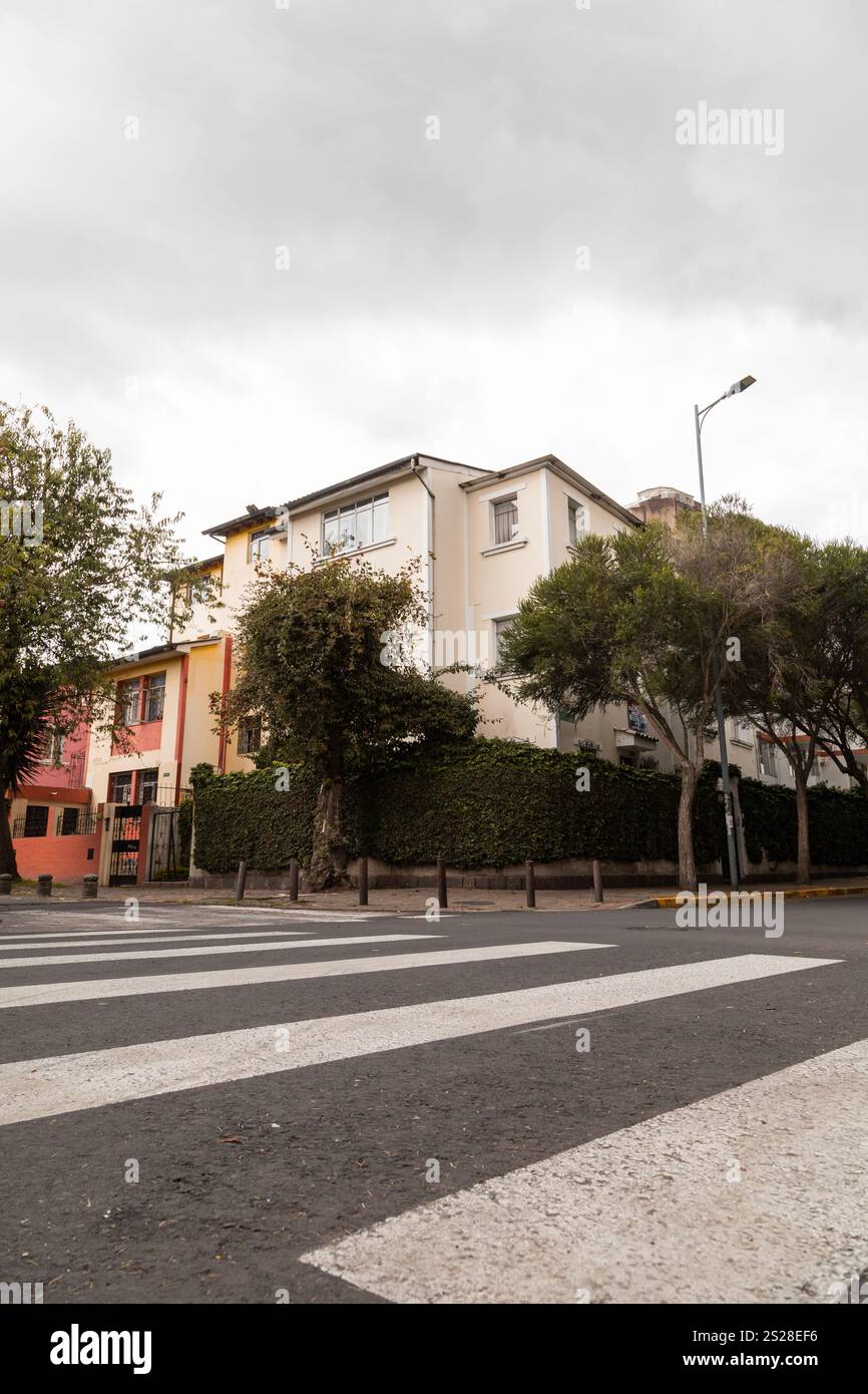 A corner house viewed from the perspective of a pedestrian crosswalk ...
