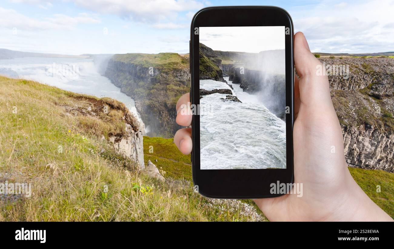 travel concept - tourist photographs Gullfoss waterfall at the canyon ...