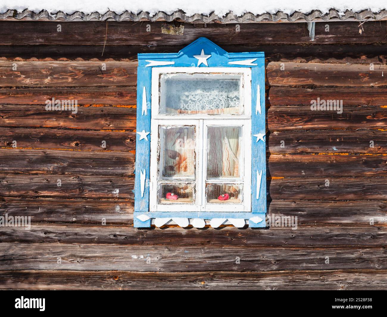 wood log wall with window of old typical russian rural house in sunny ...