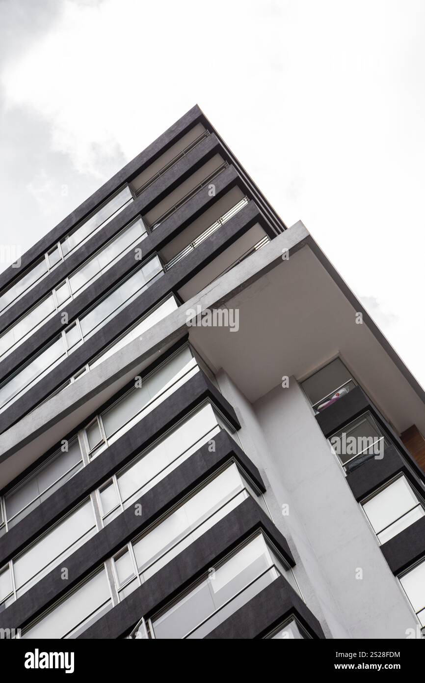 A sleek, modern black building with minimalist design. The dark ...