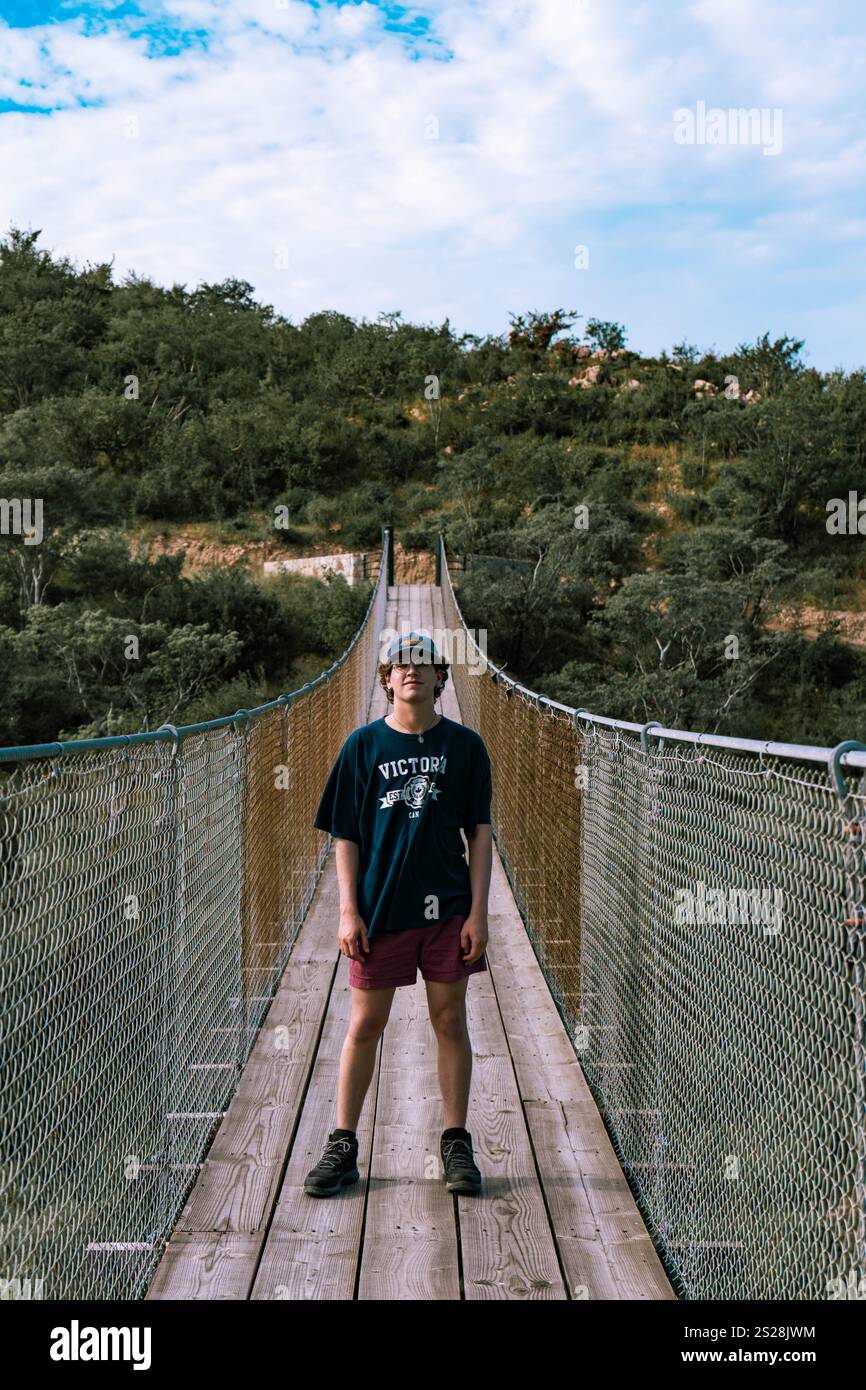 Young man hiking in tropical hi-res stock photography and images - Alamy