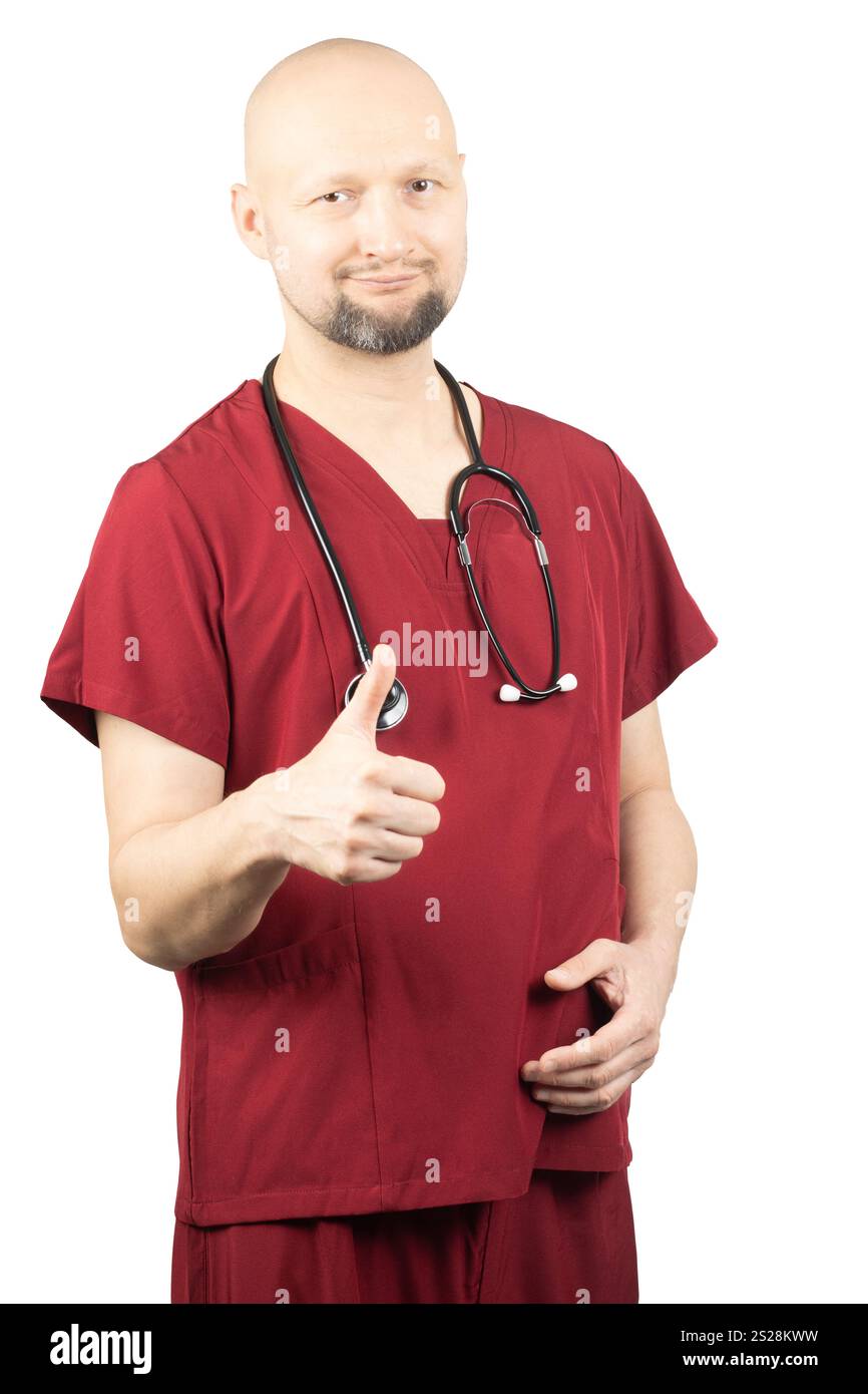 A bald male healthcare worker with a beard is wearing red scrubs and ...