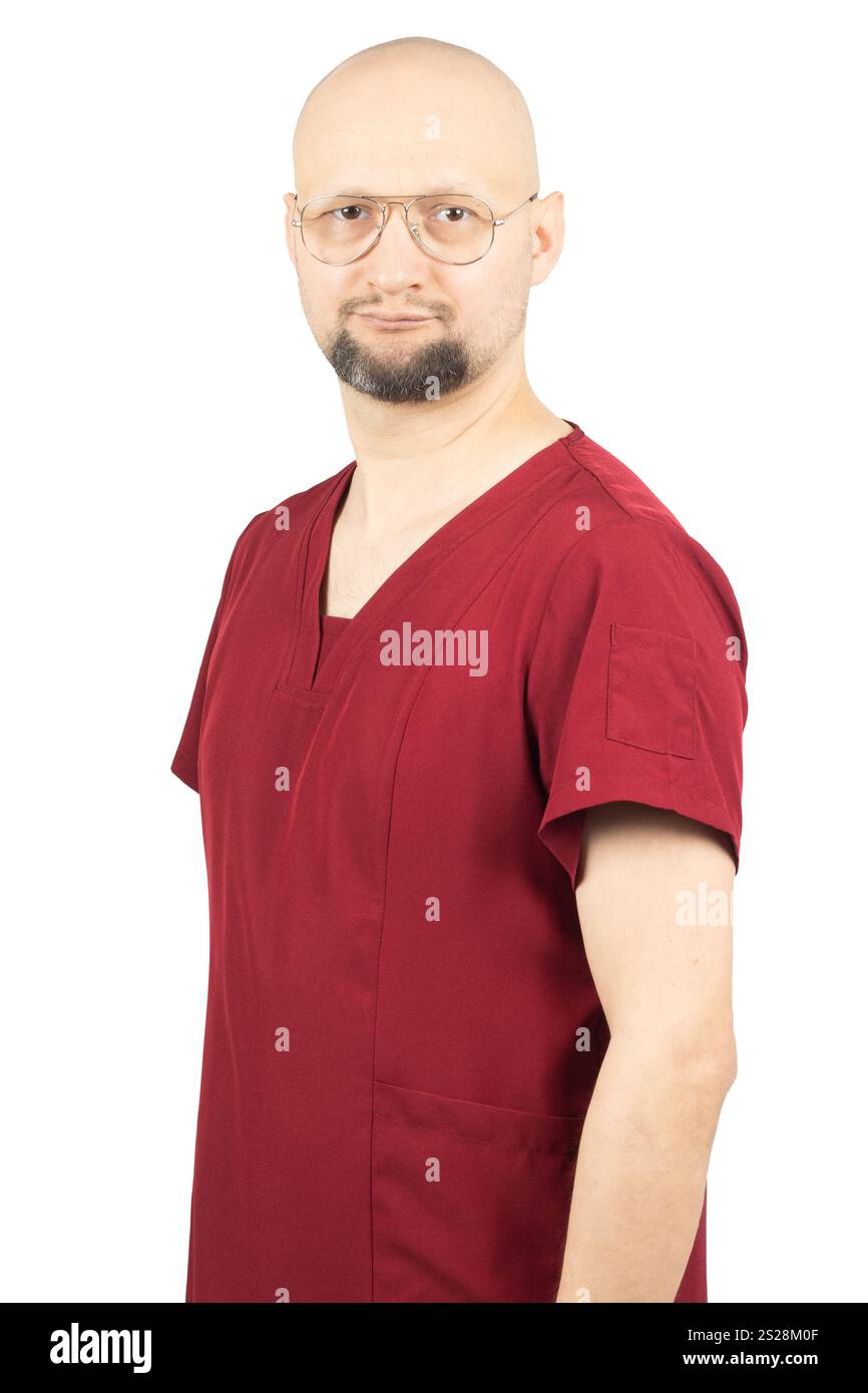 A bald male healthcare worker with a beard is wearing red medical ...
