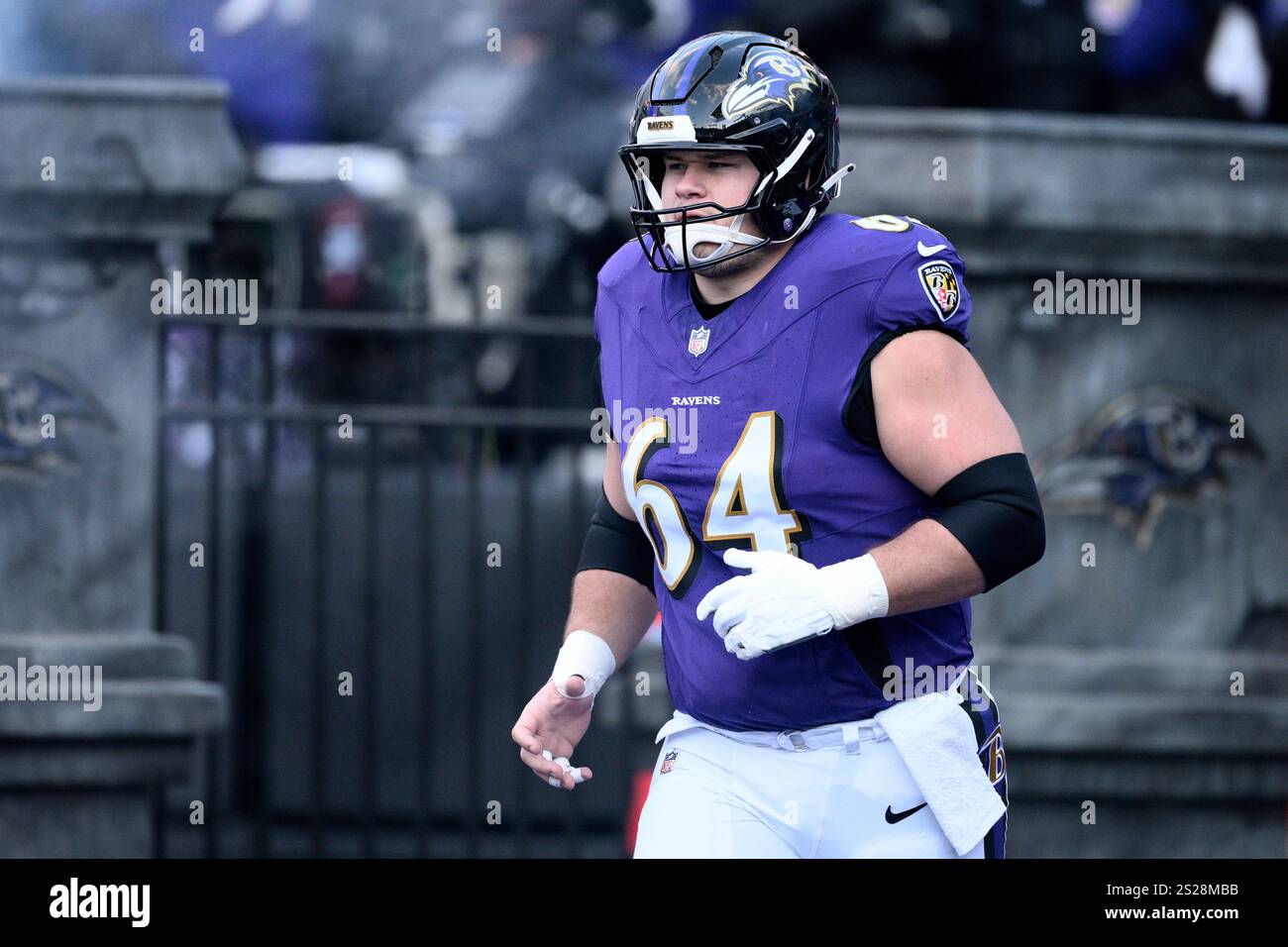 Baltimore Ravens center Tyler Linderbaum (64) takes to the field before ...