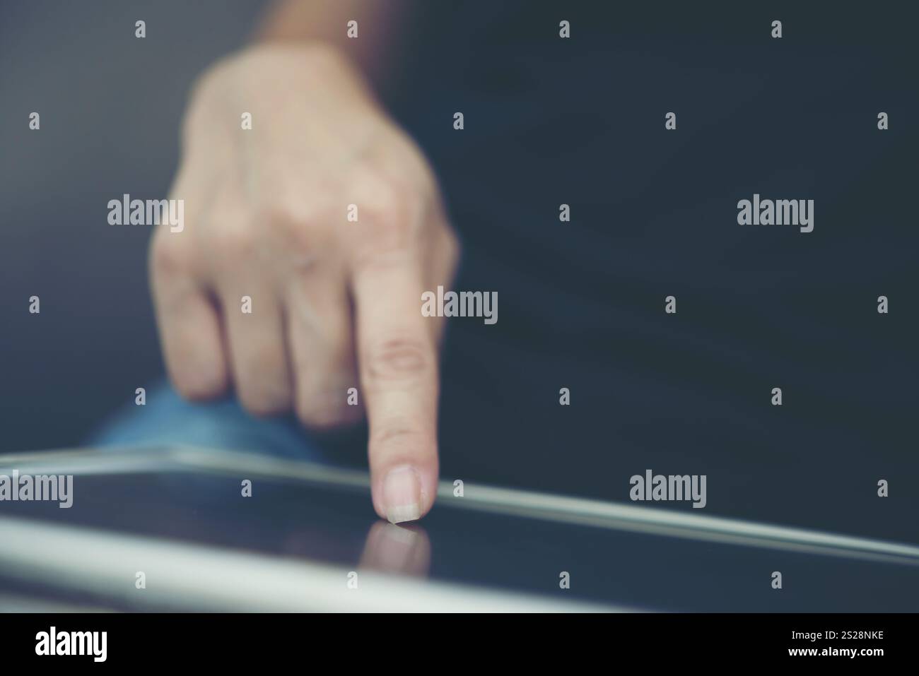 Close up man hands using tablet sitting and relaxing Stock Photo - Alamy