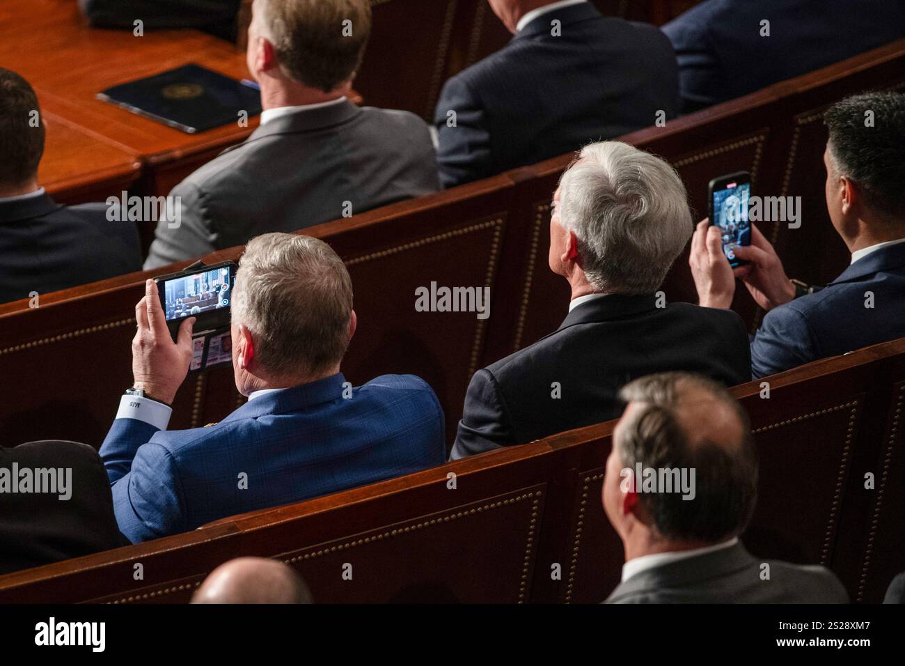Members of Congress make videos on their smart phones during the ...