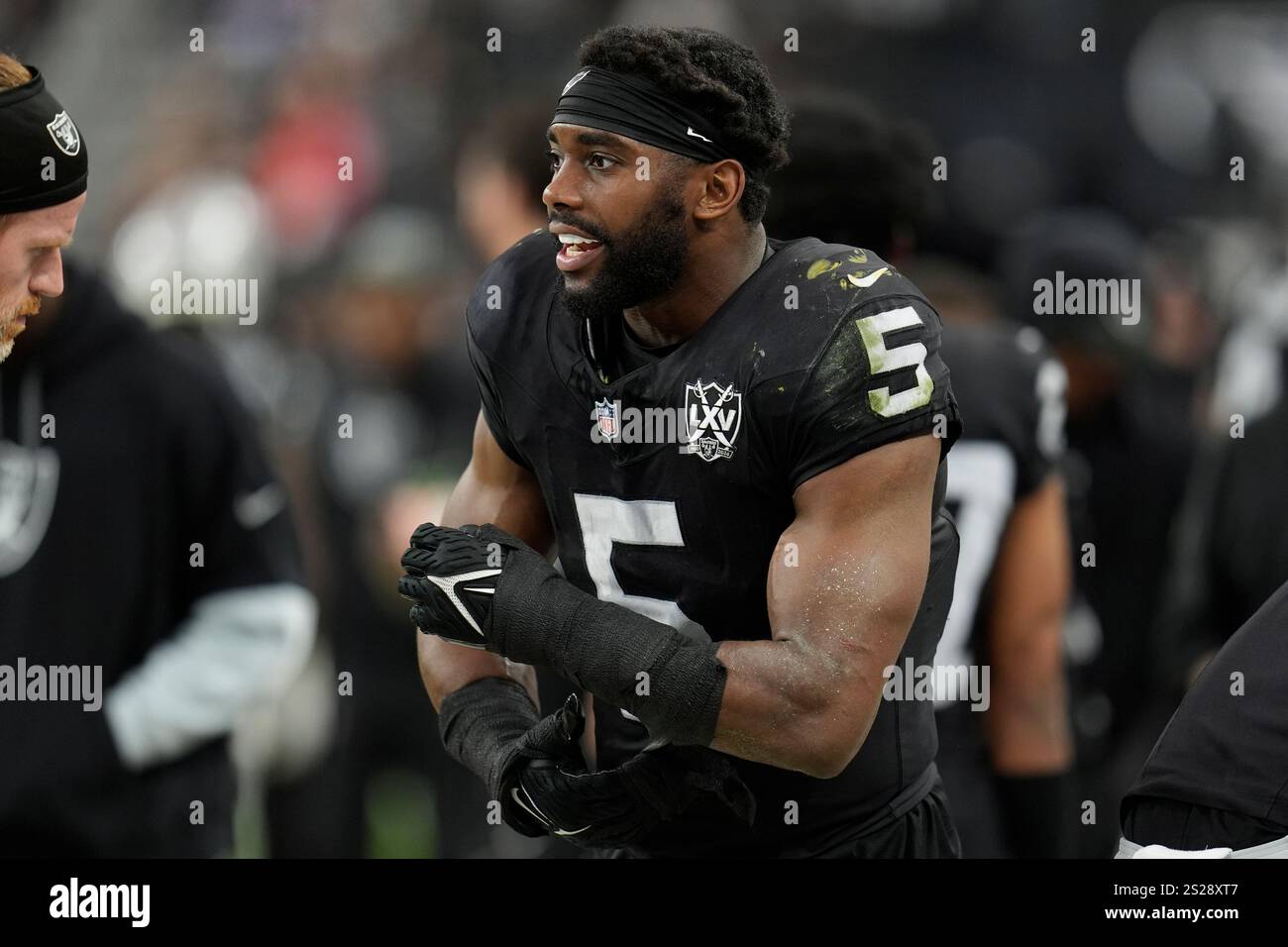 Las Vegas Raiders linebacker Divine Deablo (5) stands on the sideline ...
