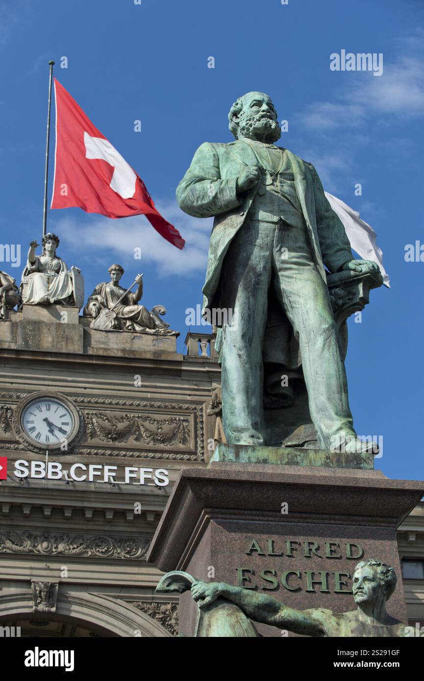 Swiss flag behind monument to Alfred Escher, Swiss politician, business ...