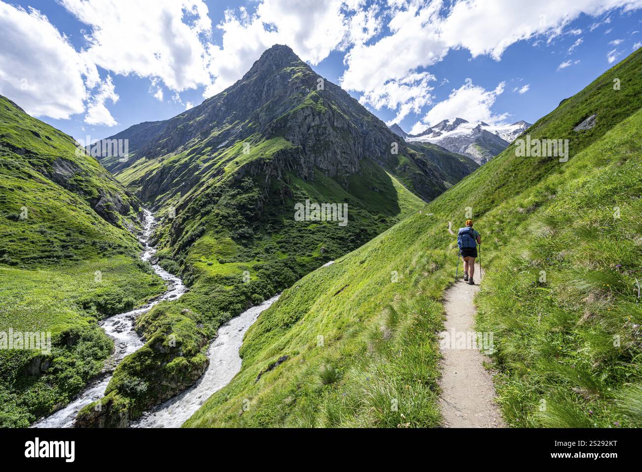 Mountaineer on a hiking trail in the Umbaltal valley, Isel and ...