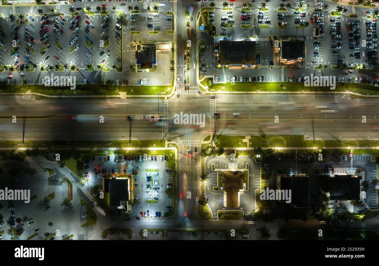 Aerial view of shopping plaza stores and American wide highway with ...