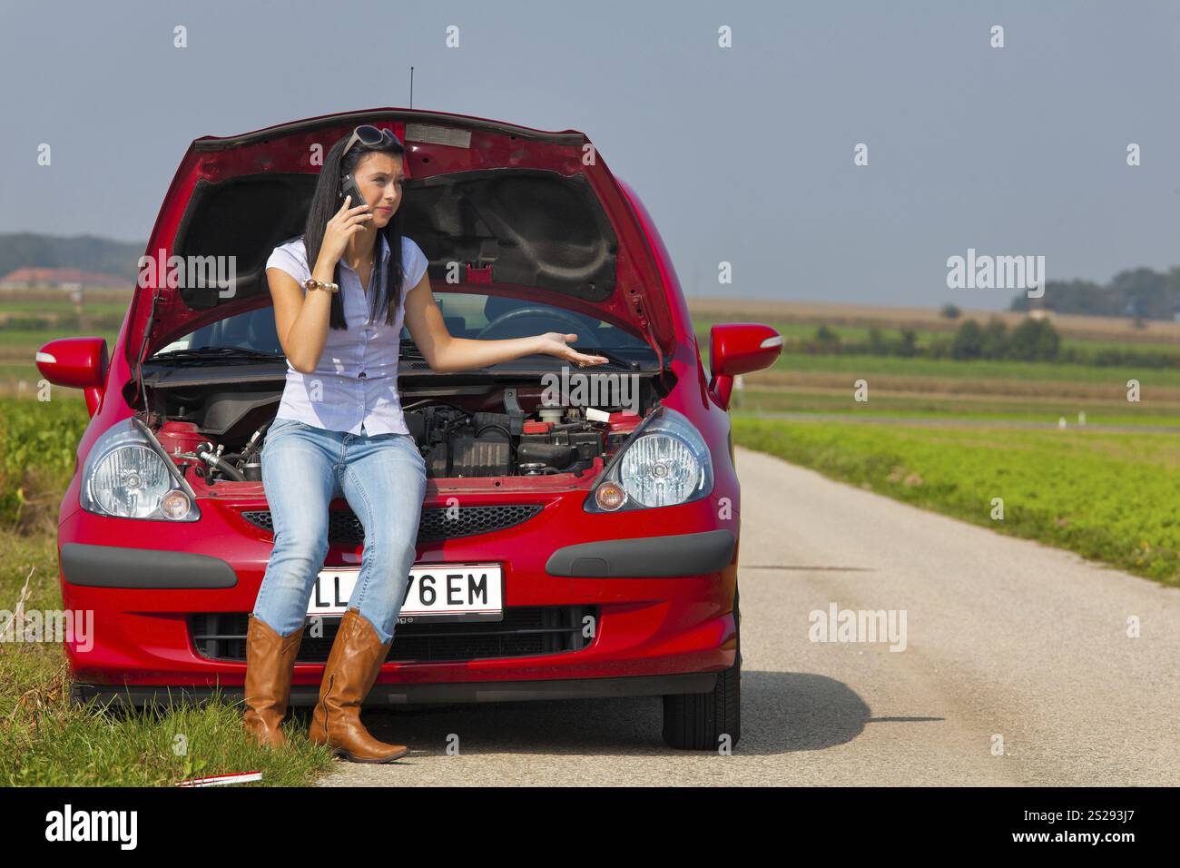 Young woman's car breaks down. Engine failure Austria Stock Photo - Alamy