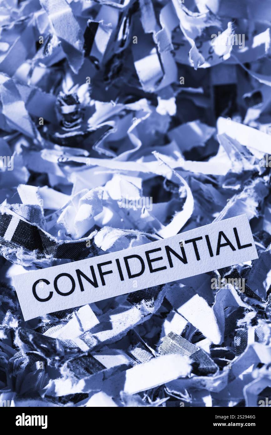 Paper shreds with the keyword Confidential, symbolic photo for data ...