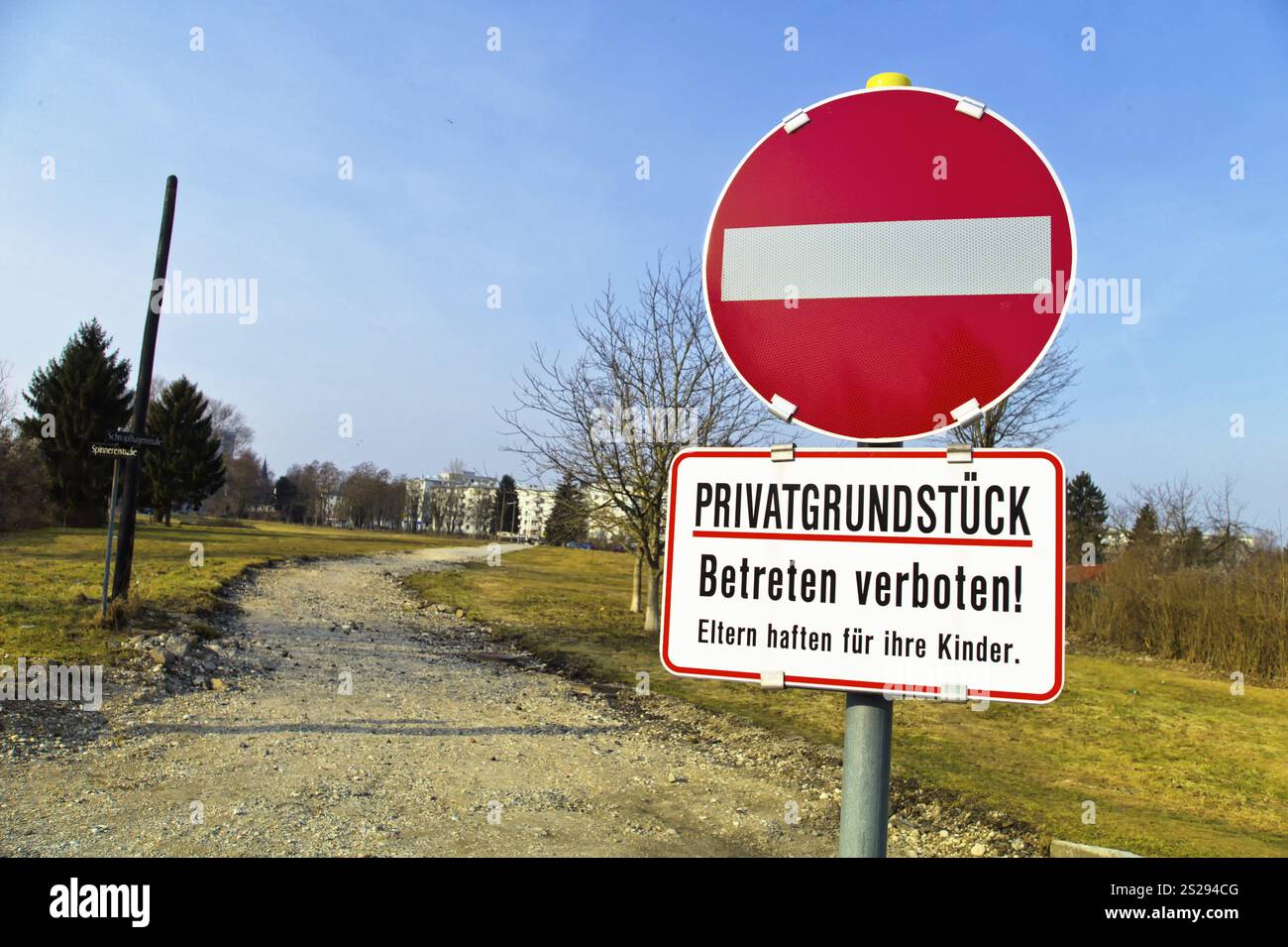 A path is secured by a sign Private property - no trespassing Stock ...