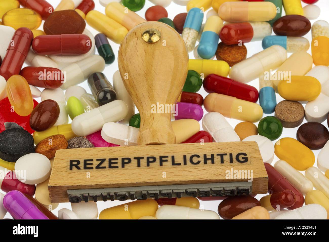 Stamp on coloured tablets, symbol photo for medication, prescription ...