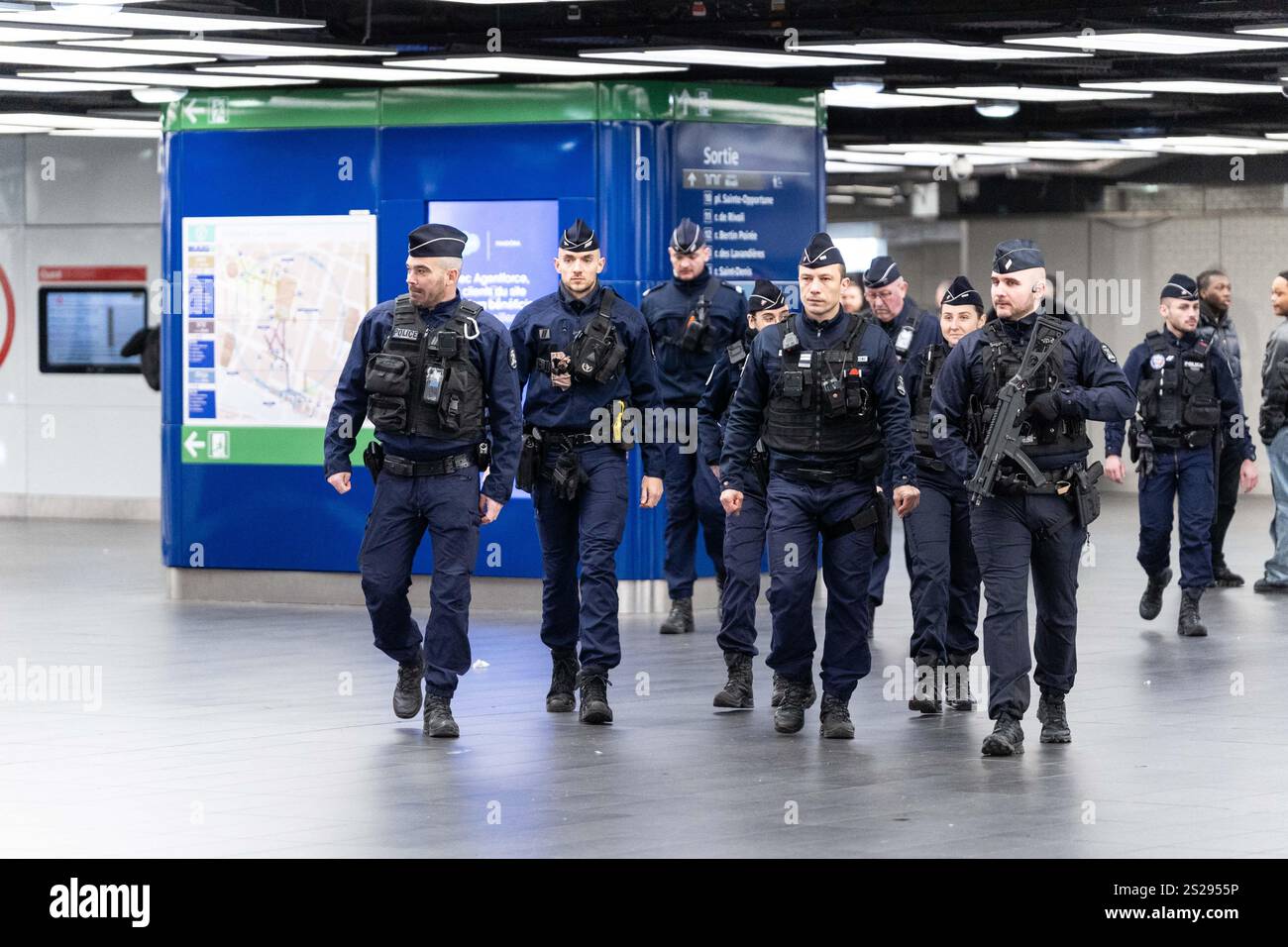 Paris, France. 06th Jan, 2025. A group of police officers walk in the ...