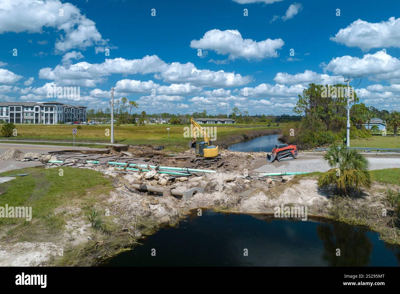 Construction equipment at roadworks site. Reconstruction of damaged ...