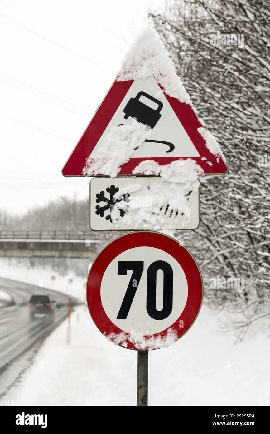 Traffic signs and fresh snow, symbolic photo for winter weather ...