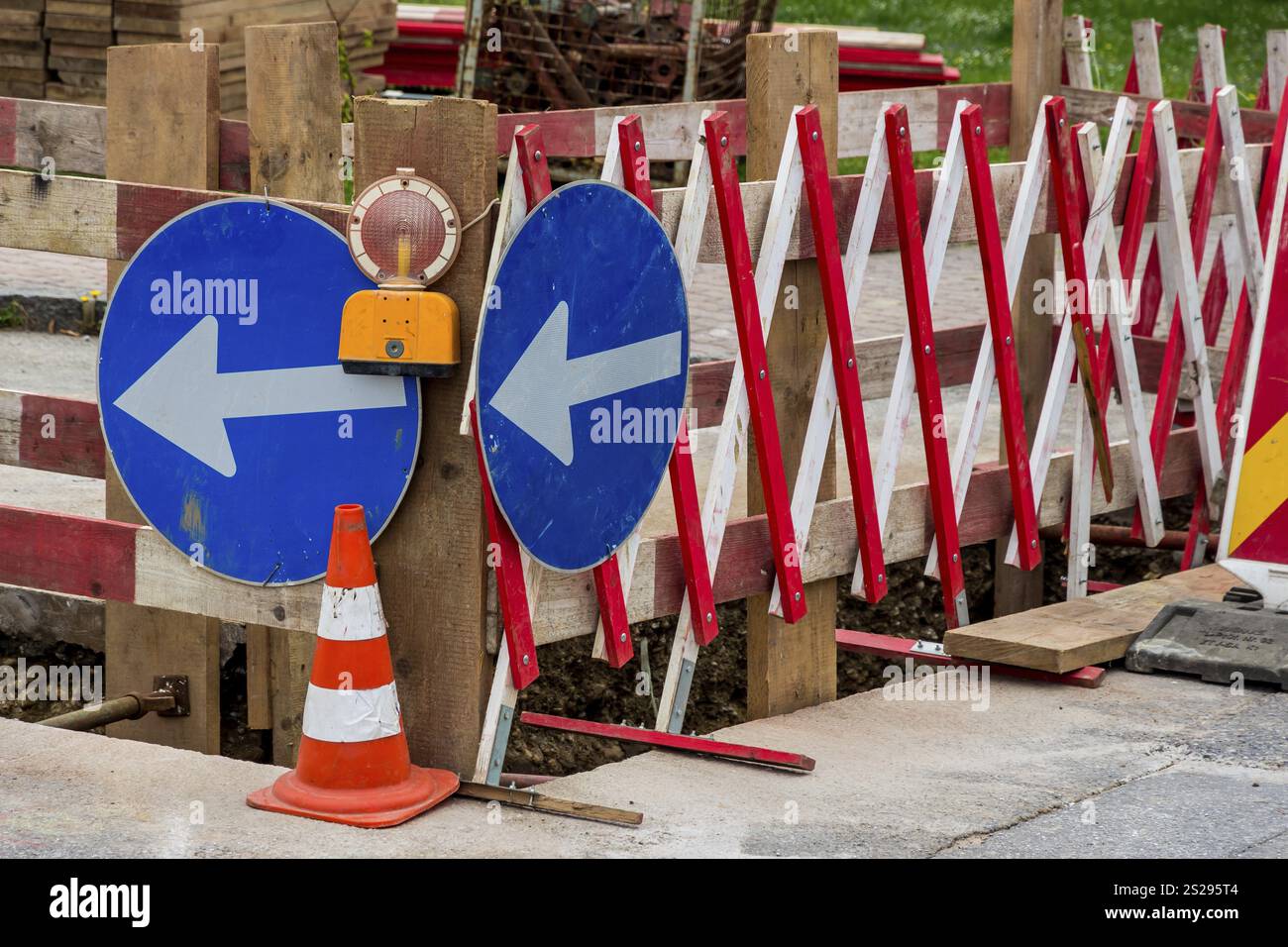 A road construction site Signposts secure the construction site on a ...