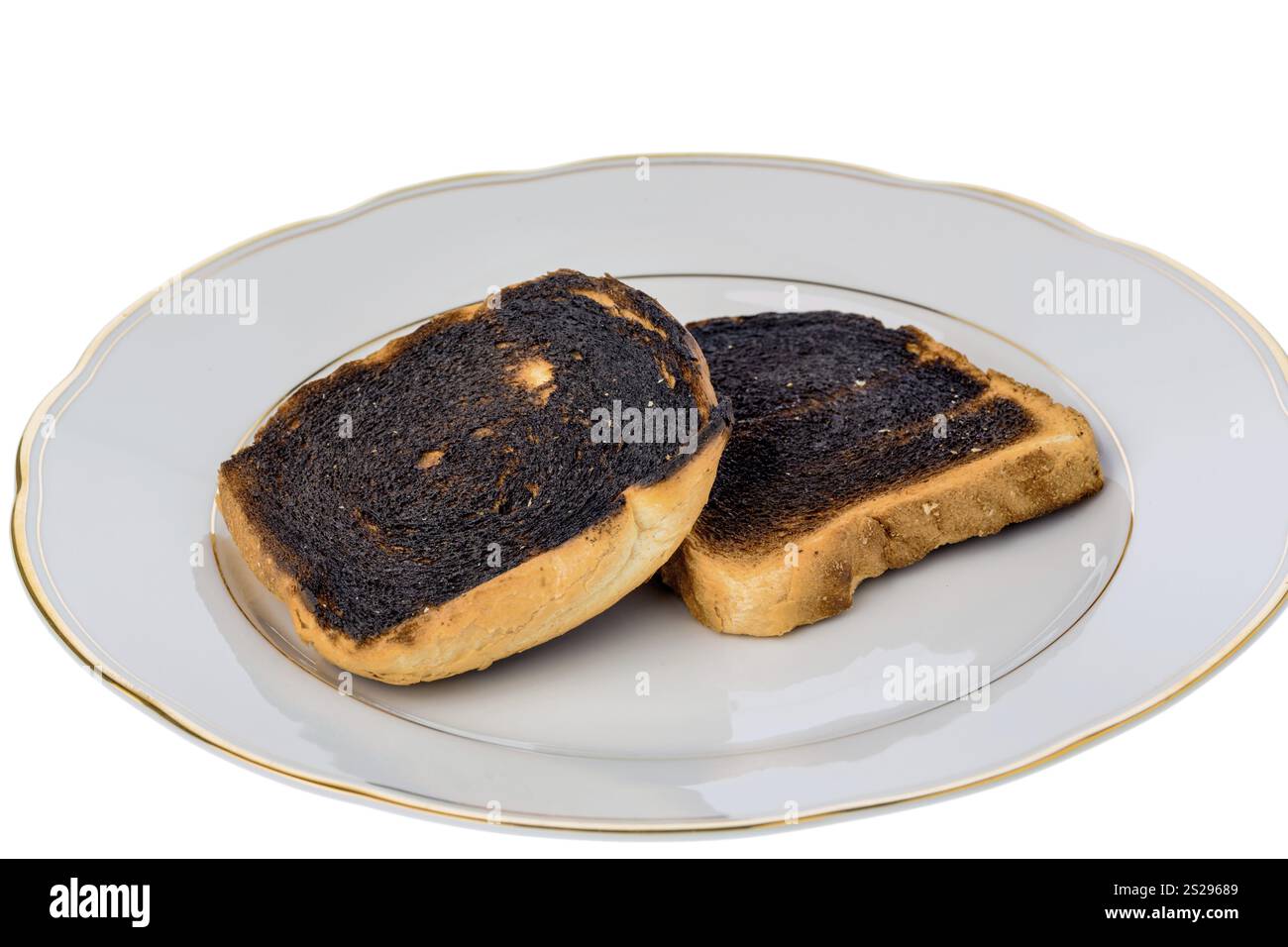 Toast was burnt during toasting. Burnt slices of toast at breakfast ...