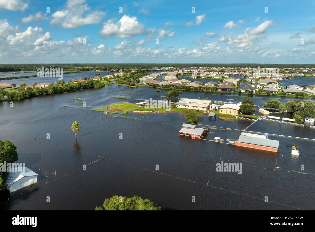Farmland area flooded after hurricane rains. Underwater farm buildings ...