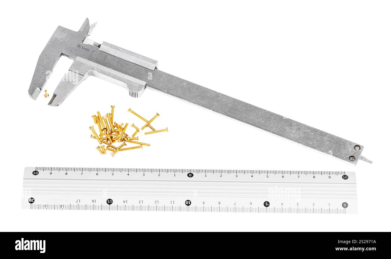 old steel callipers, metallic ruler and lot of brass screws isolated on ...
