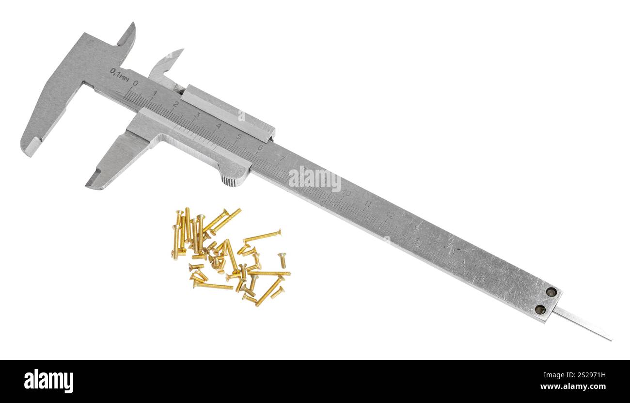 old steel calipers and lot of brass screws isolated on white background ...
