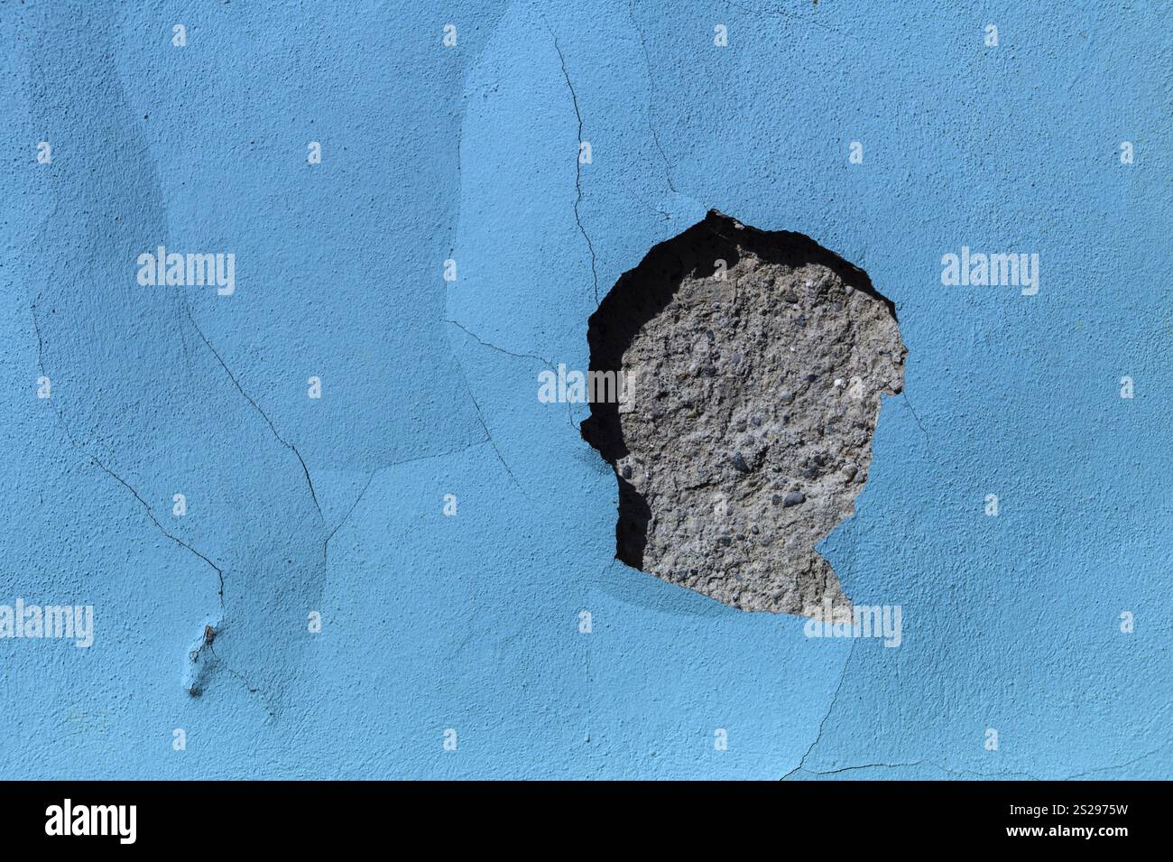 Peeling blue paint on a building, symbolic photo of damp and decay ...