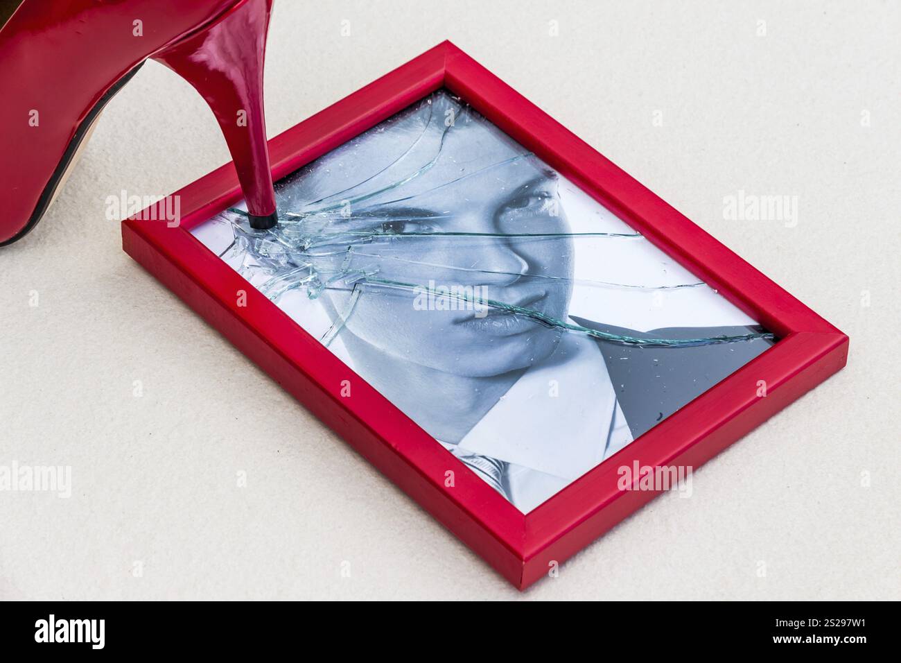Broken picture frame and high heels. Symbolic photo for divorce ...