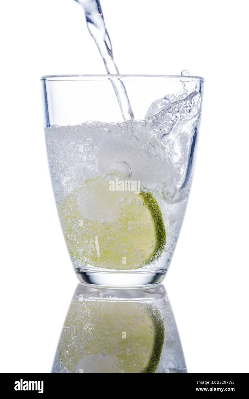 A glass of fresh drinking water and a lime. Mineral water as a thirst quencher. Austria Stock ...