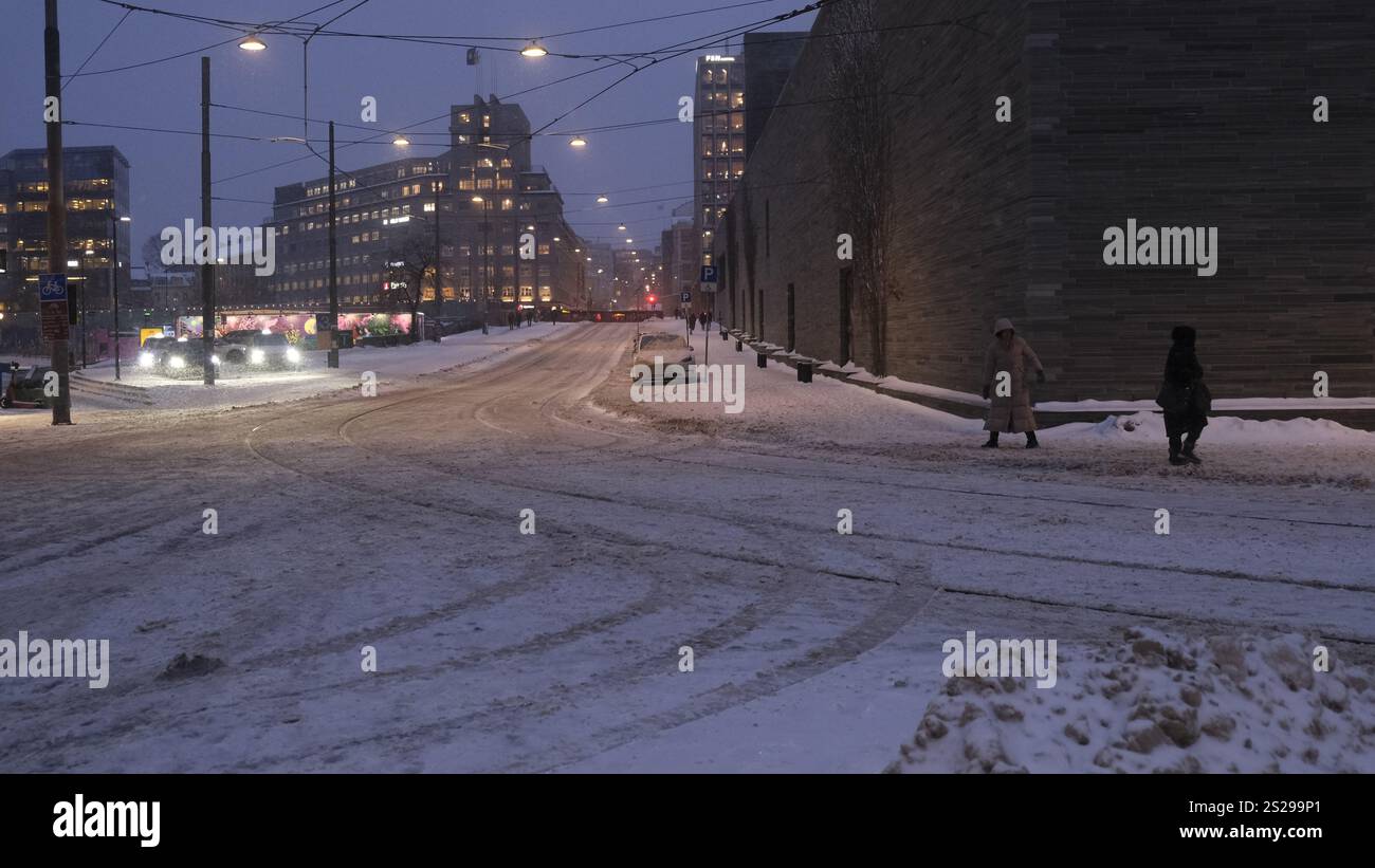 Oslo, Norway. 6th Jan, 2025. Pedestrians walk on a street in snow in ...