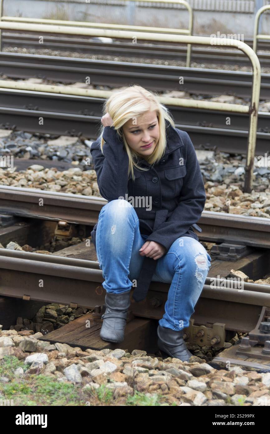 Depressed young woman railway hi-res stock photography and images - Alamy