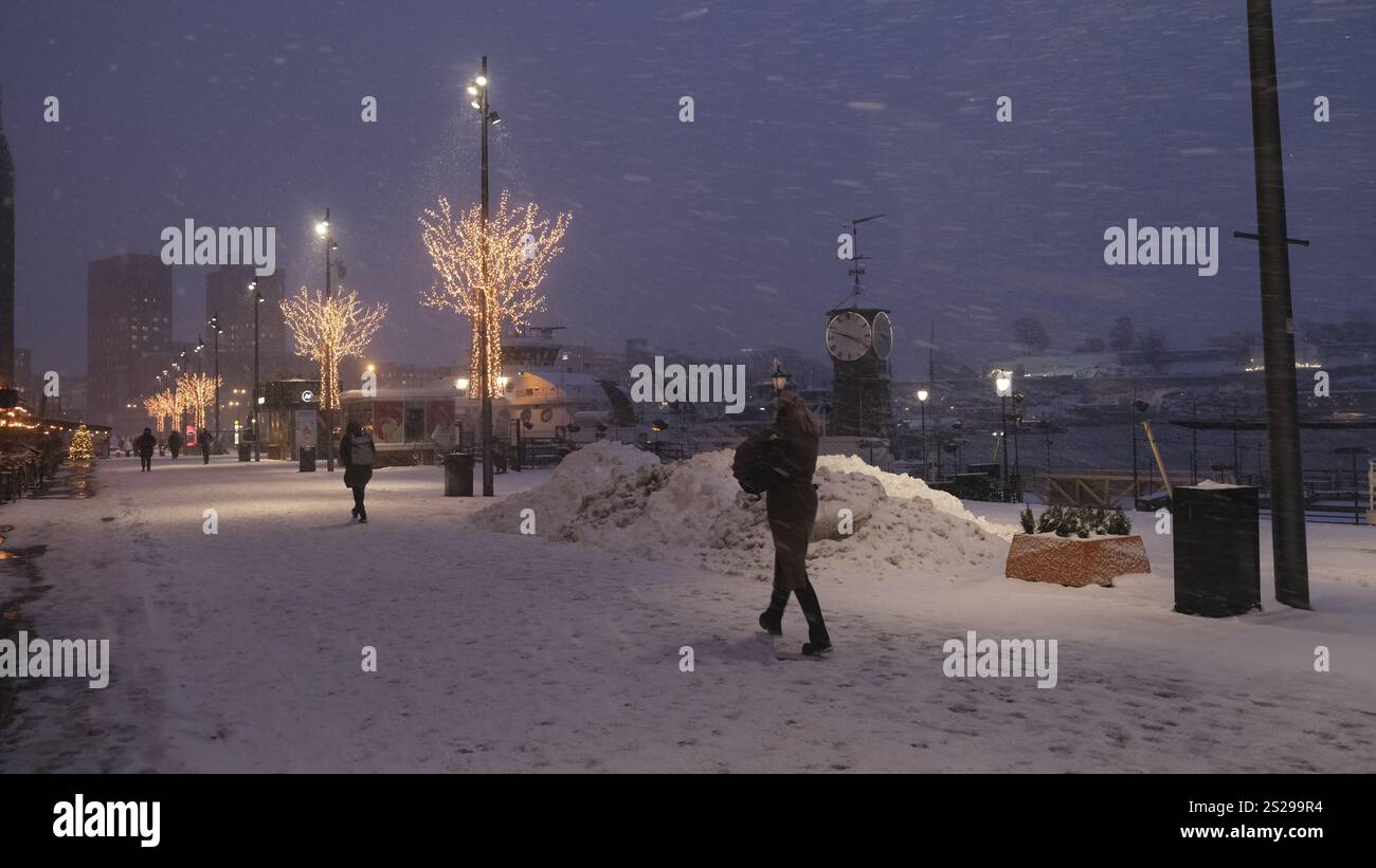 Oslo, Norway. 6th Jan, 2025. Pedestrians walk on a street in snow in ...