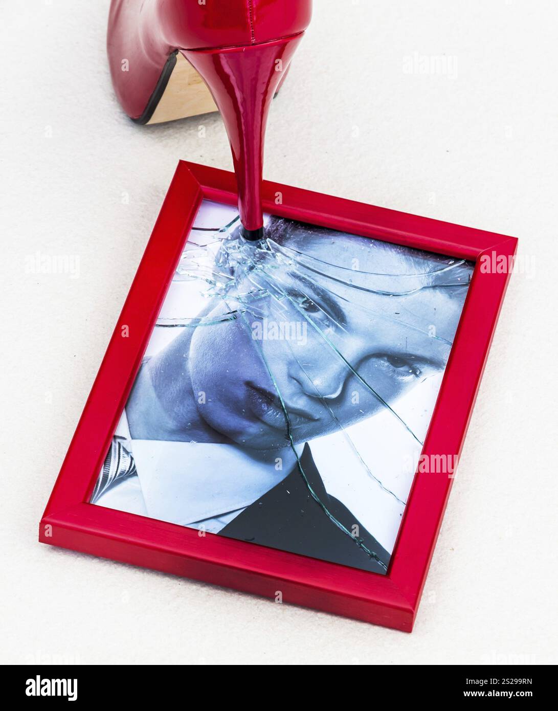 Broken picture frame and high heels. Symbolic photo for divorce ...