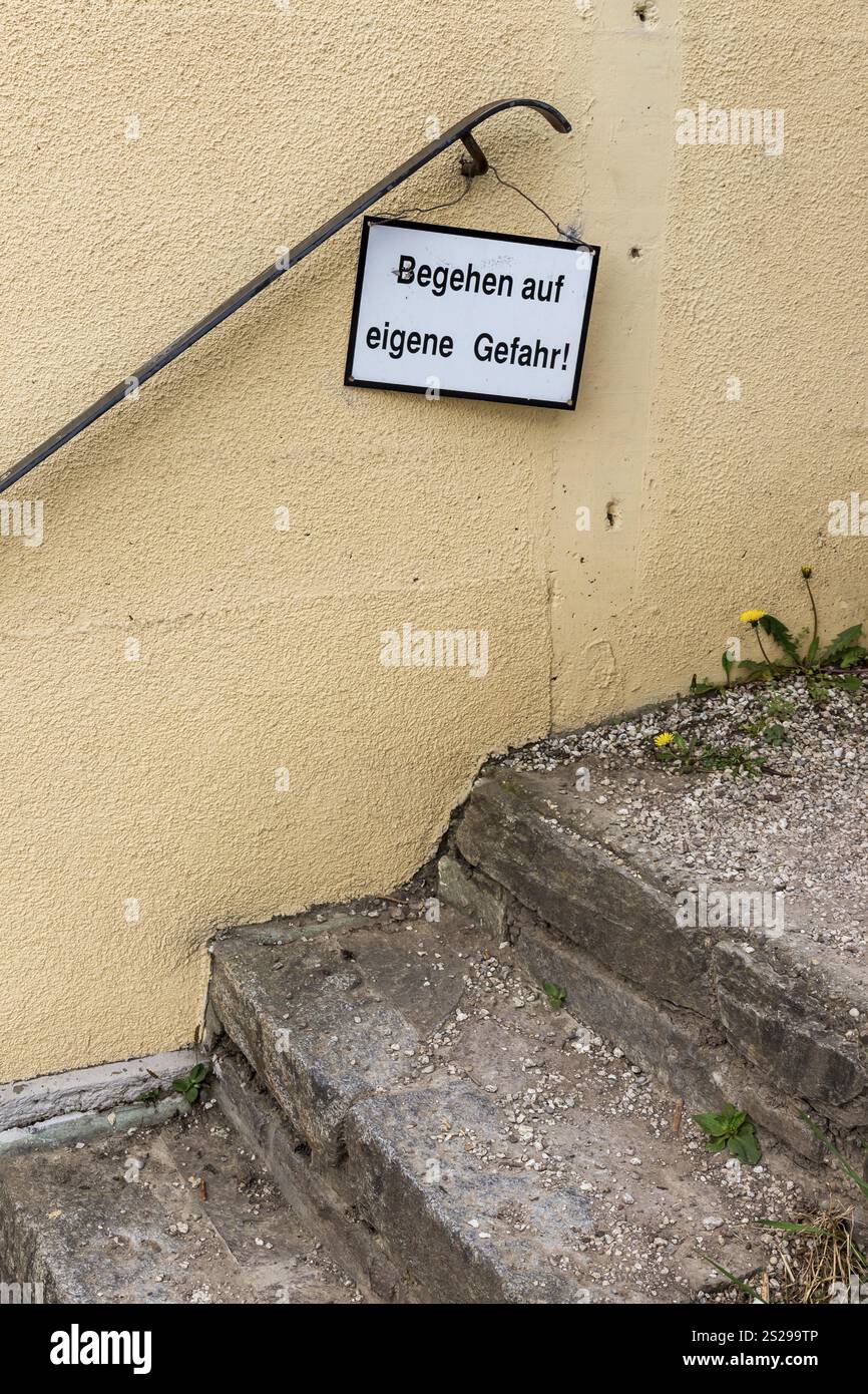 A sign Walk at your own risk. Warning of uncleared paths Austria Stock ...