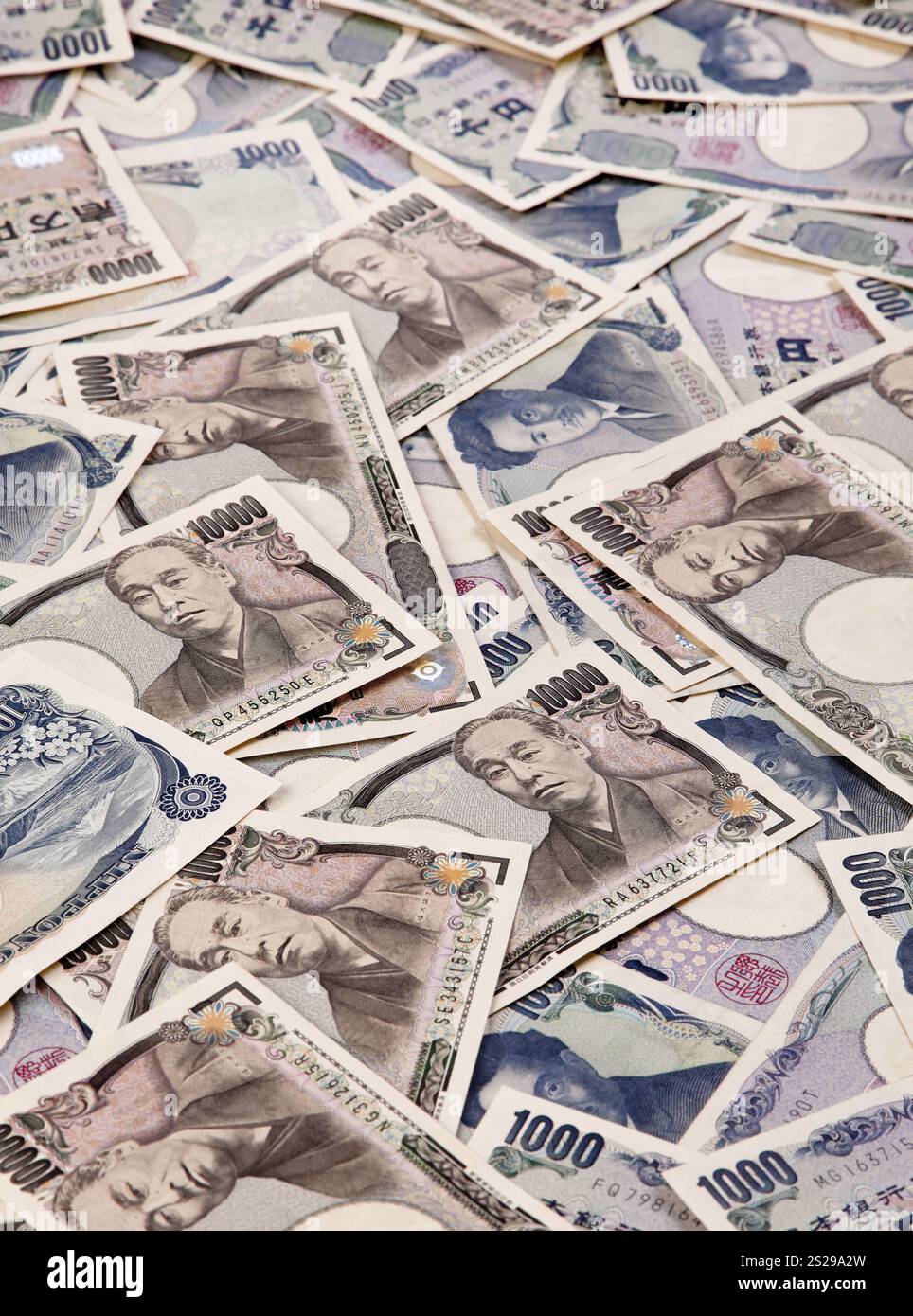 Many Japanese yen currency notes Stock Photo - Alamy