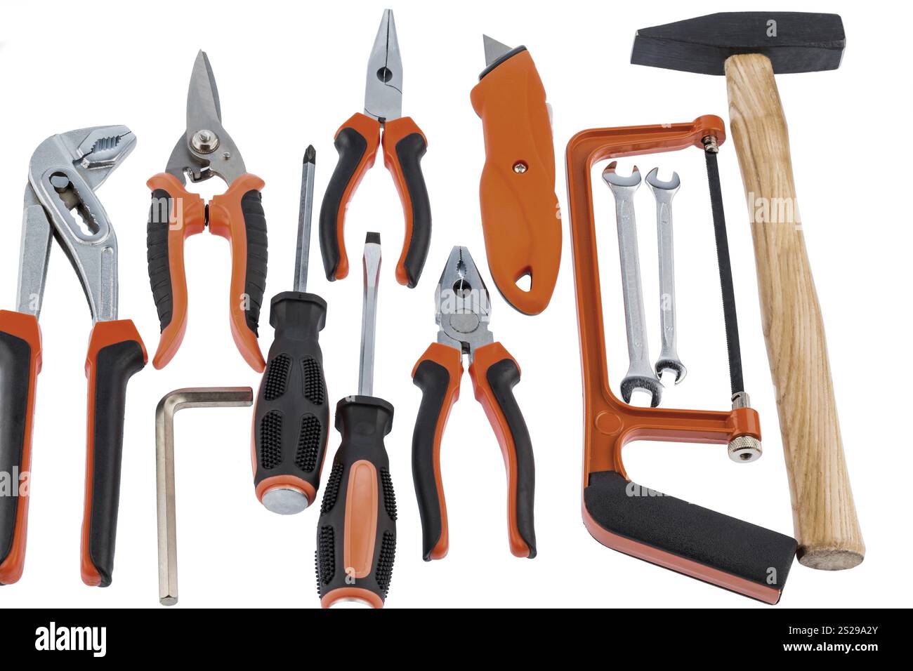 Various tools of a craftsman lie next to each other on a white ...