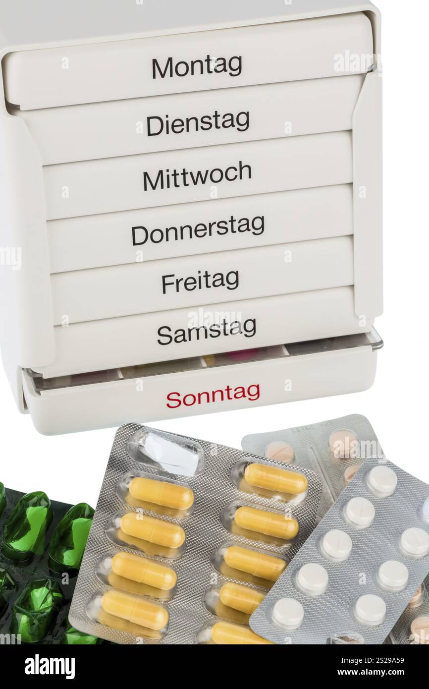 Tablet dispenser and tablets, symbol photo for therapy, prescription ...