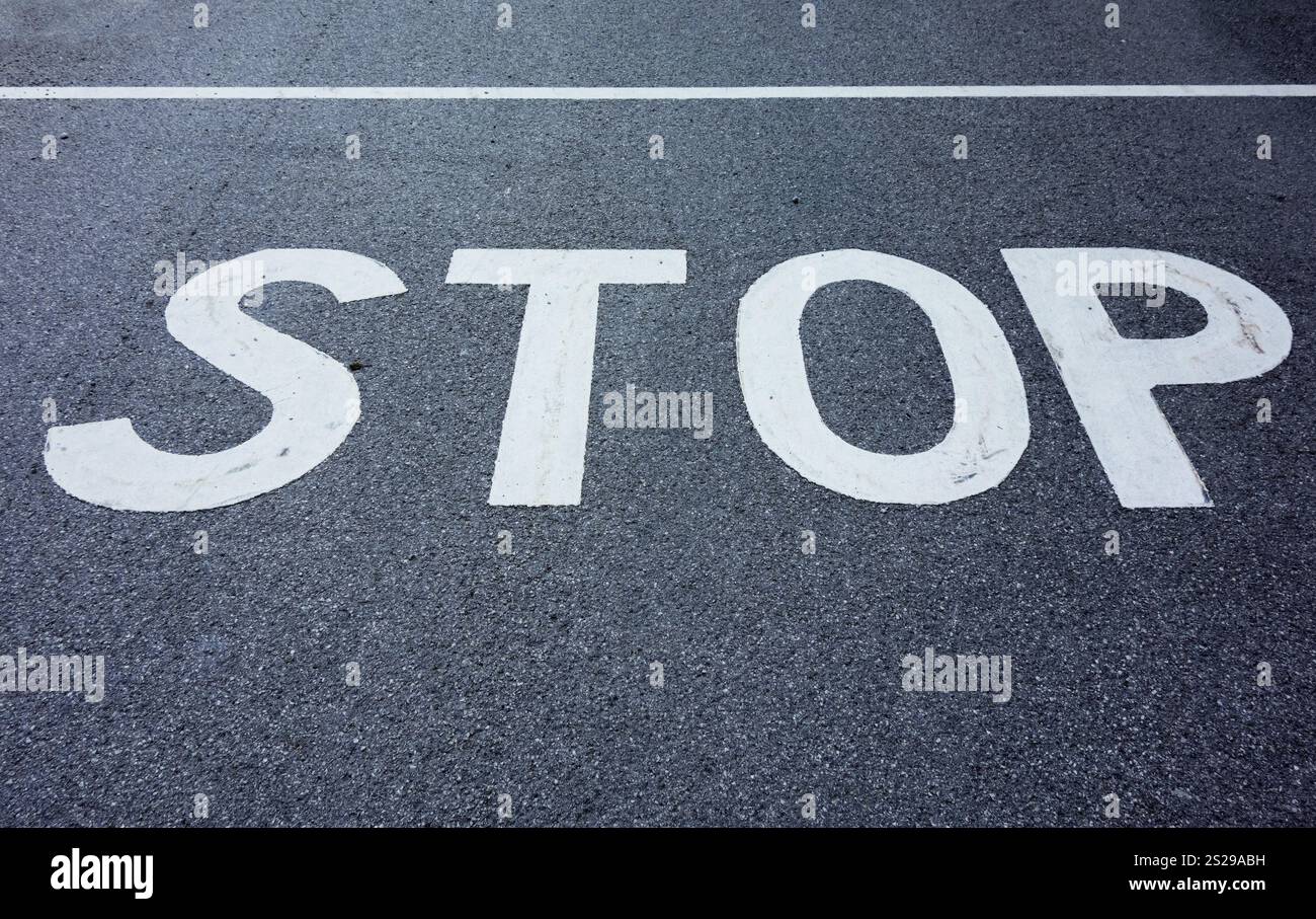 The sign Stop on a road Stop in front of a junction because of stop ...