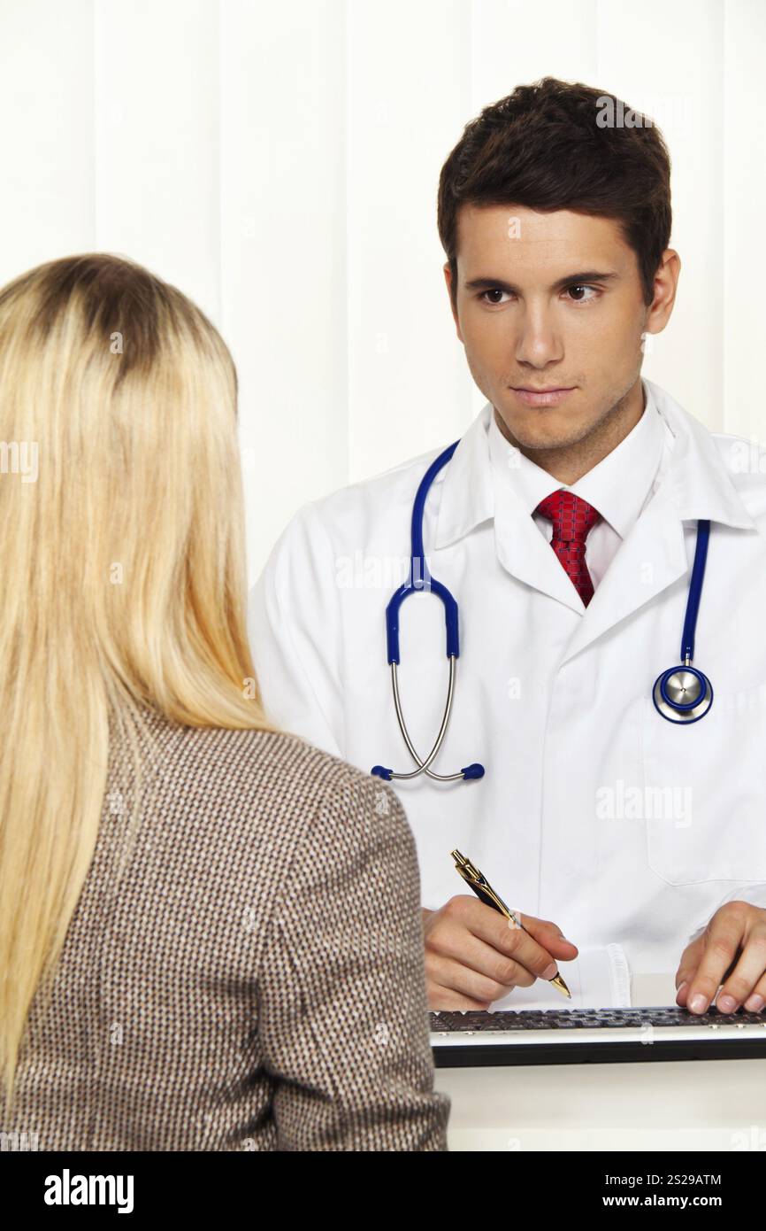 Conversation with a doctor. Patient and doctor talking in a doctor's ...