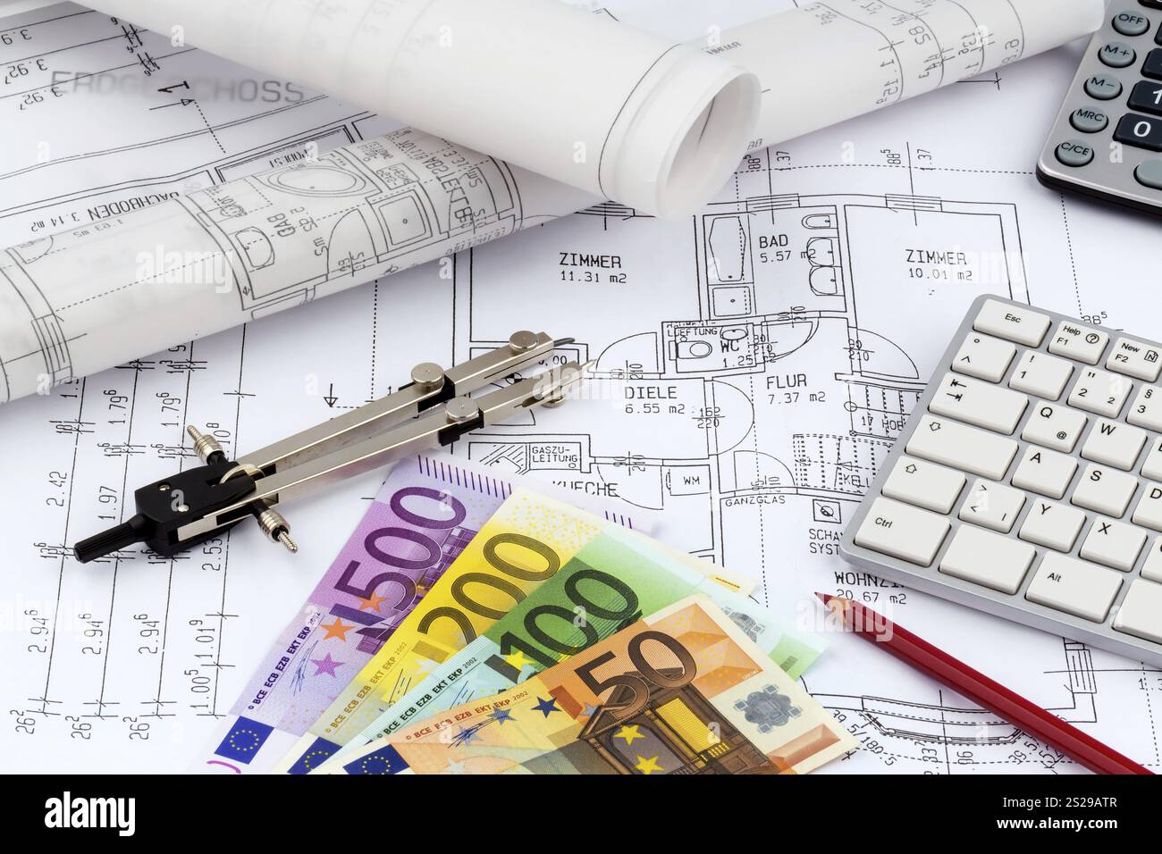 An architect's construction plan with euro money. Symbolic photo for ...
