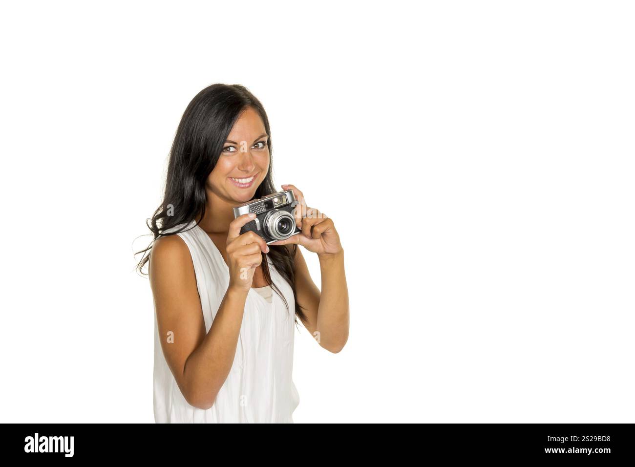A young woman takes photos with a retro camera Austria Stock Photo - Alamy