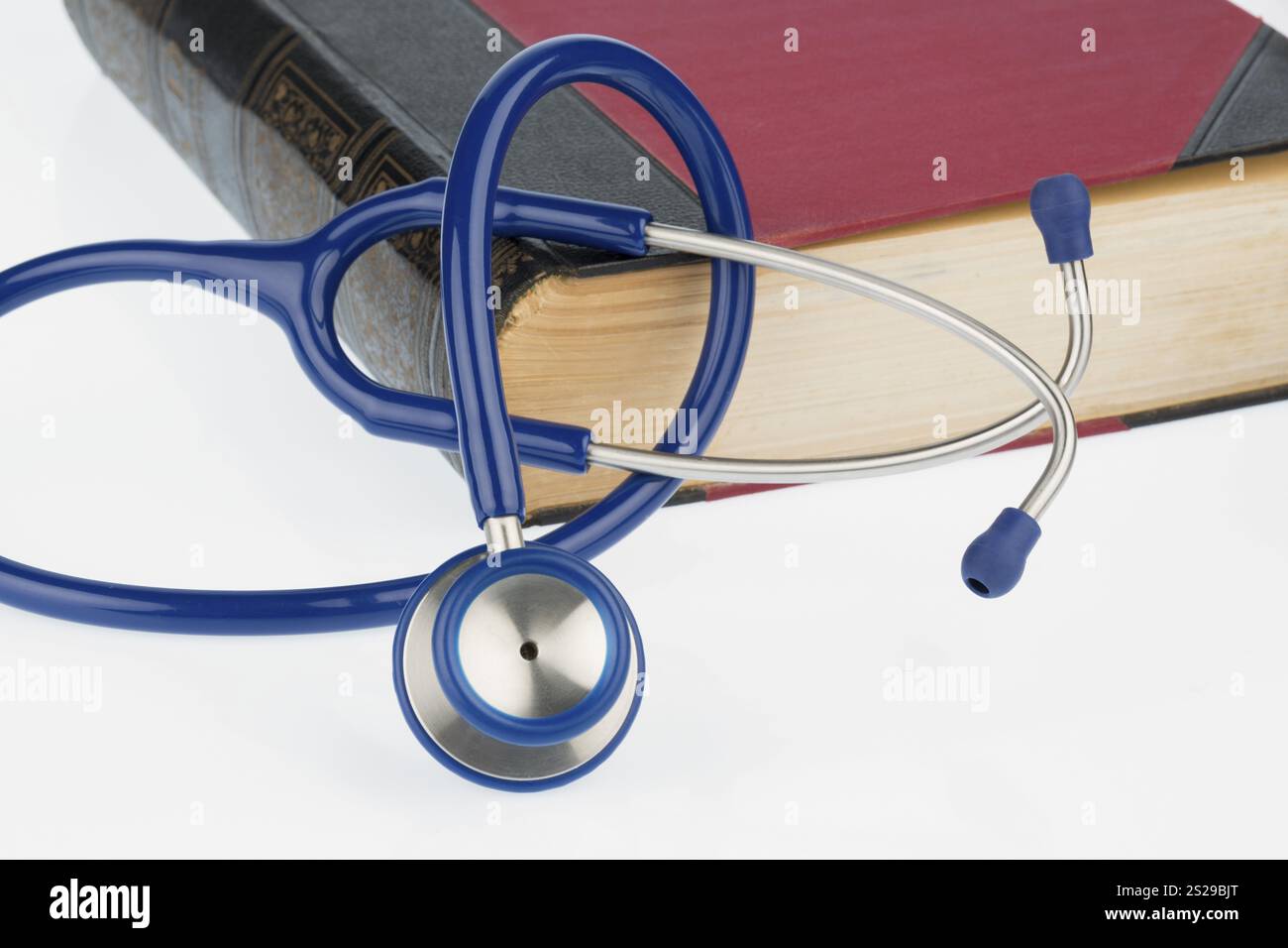 Book and stethoscope, symbolic photo for bungling, medical errors and ...