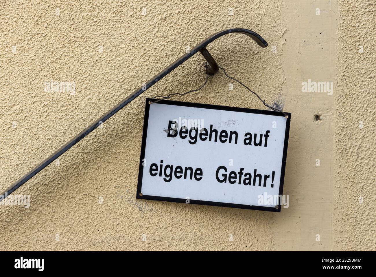 A sign Walk at your own risk. Warning of uncleared paths Austria Stock ...