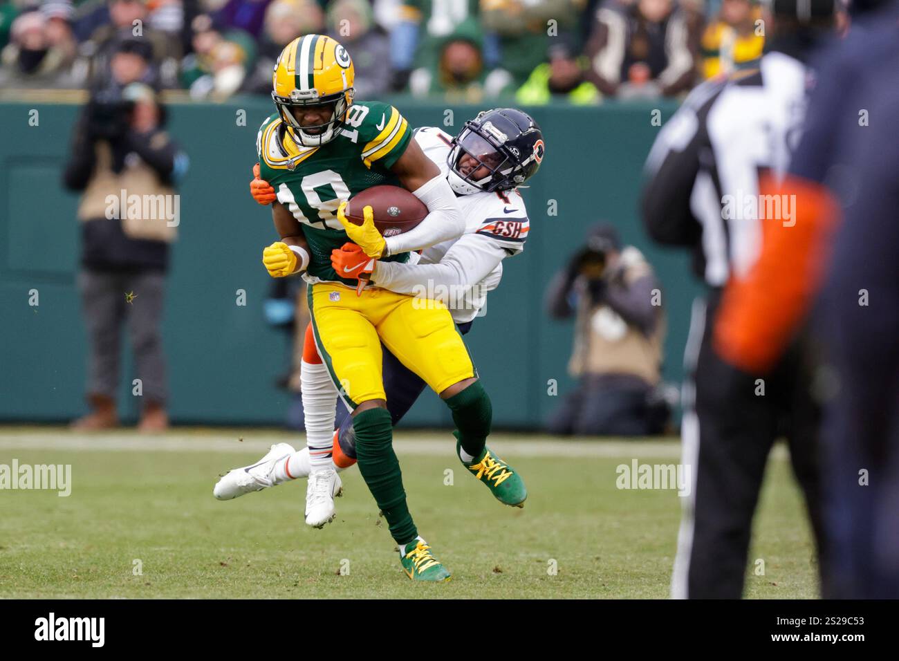 Green Bay Packers wide receiver Malik Heath (18) is hit by Chicago ...